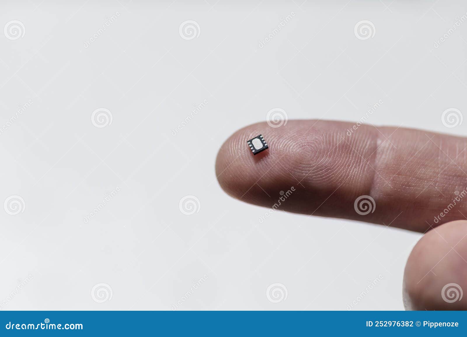 Close Up of Electronic Microchip on Human Finger Stock Photo - Image of ...