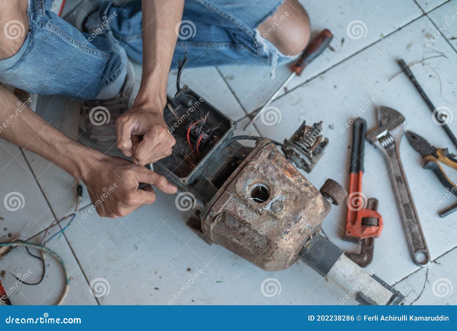 Close Up of an Electronic Worker Hand Using a Three Head Wrench To ...