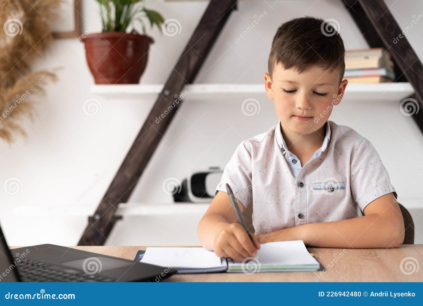 Close-up of an Elementary School Student Writes Homework while Studying ...