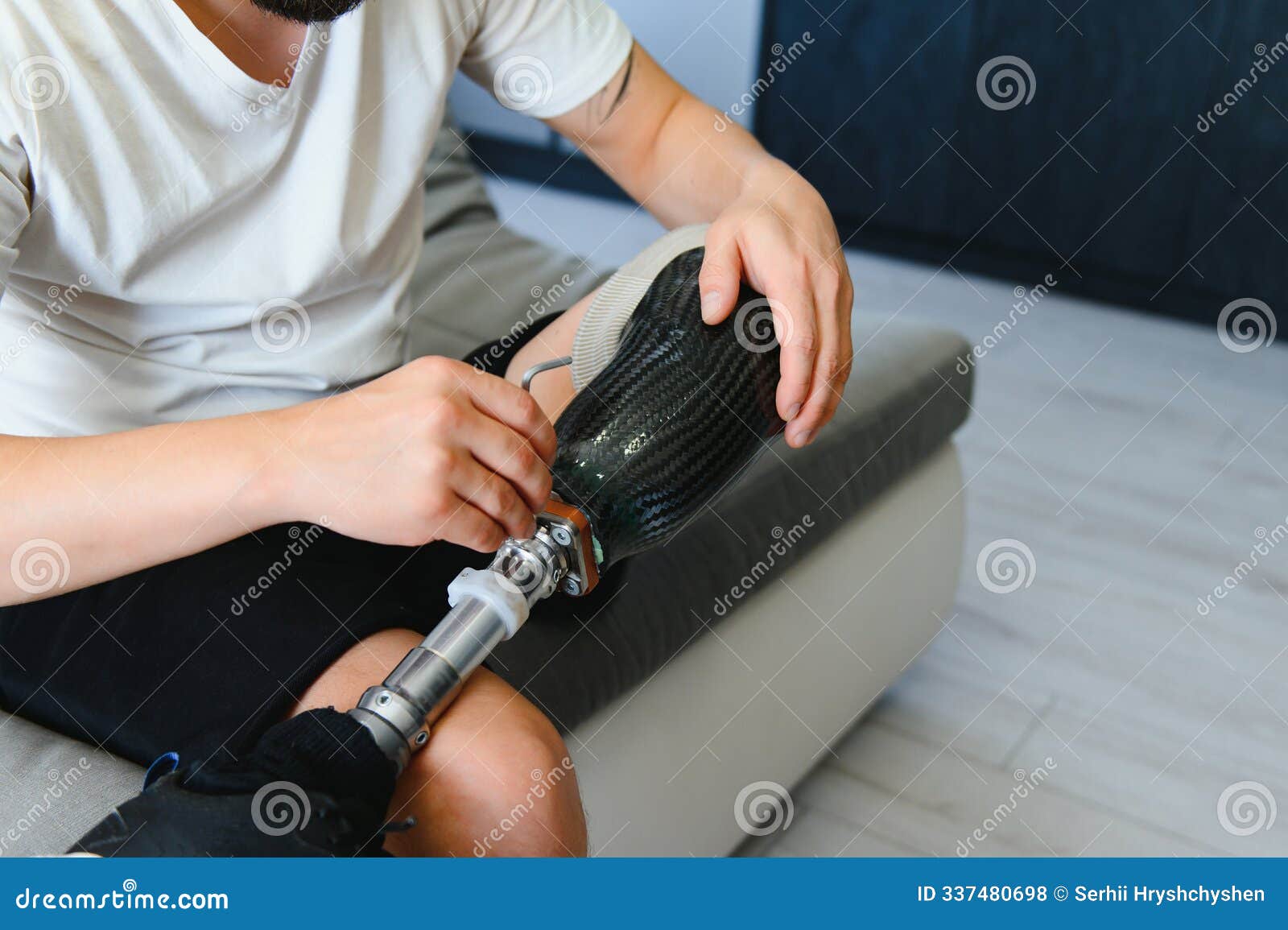 Close-up Elevated View of a Man Adjusting the Screws on an Artificial ...