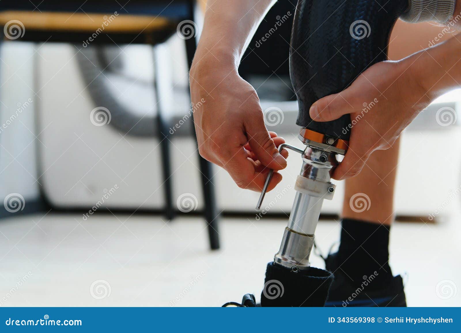 Close-up Elevated View of a Man Adjusting the Screws on an Artificial ...