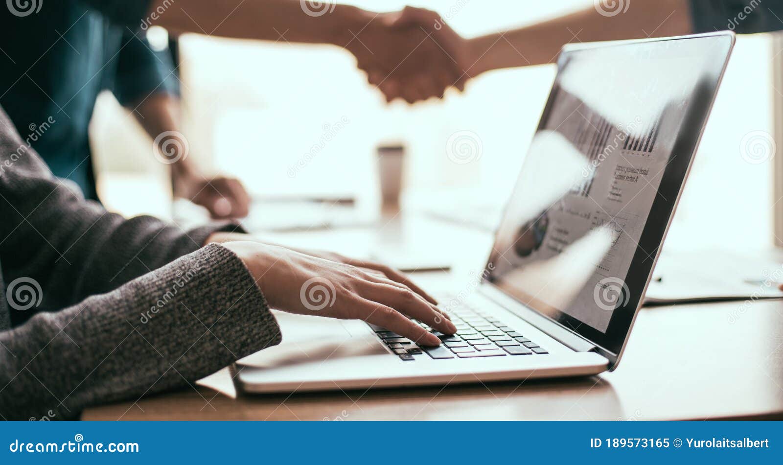 Close Up. Employee Using a Laptop at the Workplace in the Office Stock ...