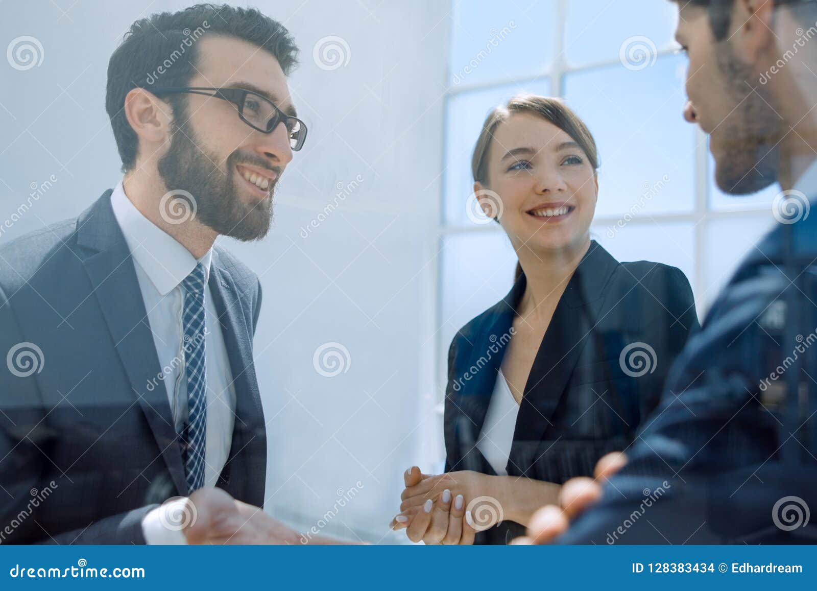 Close Up.employees Discussing New Ideas Standing in the Office Stock ... Close Up.employees Discussing New Ideas Standing in the Office Stock ...