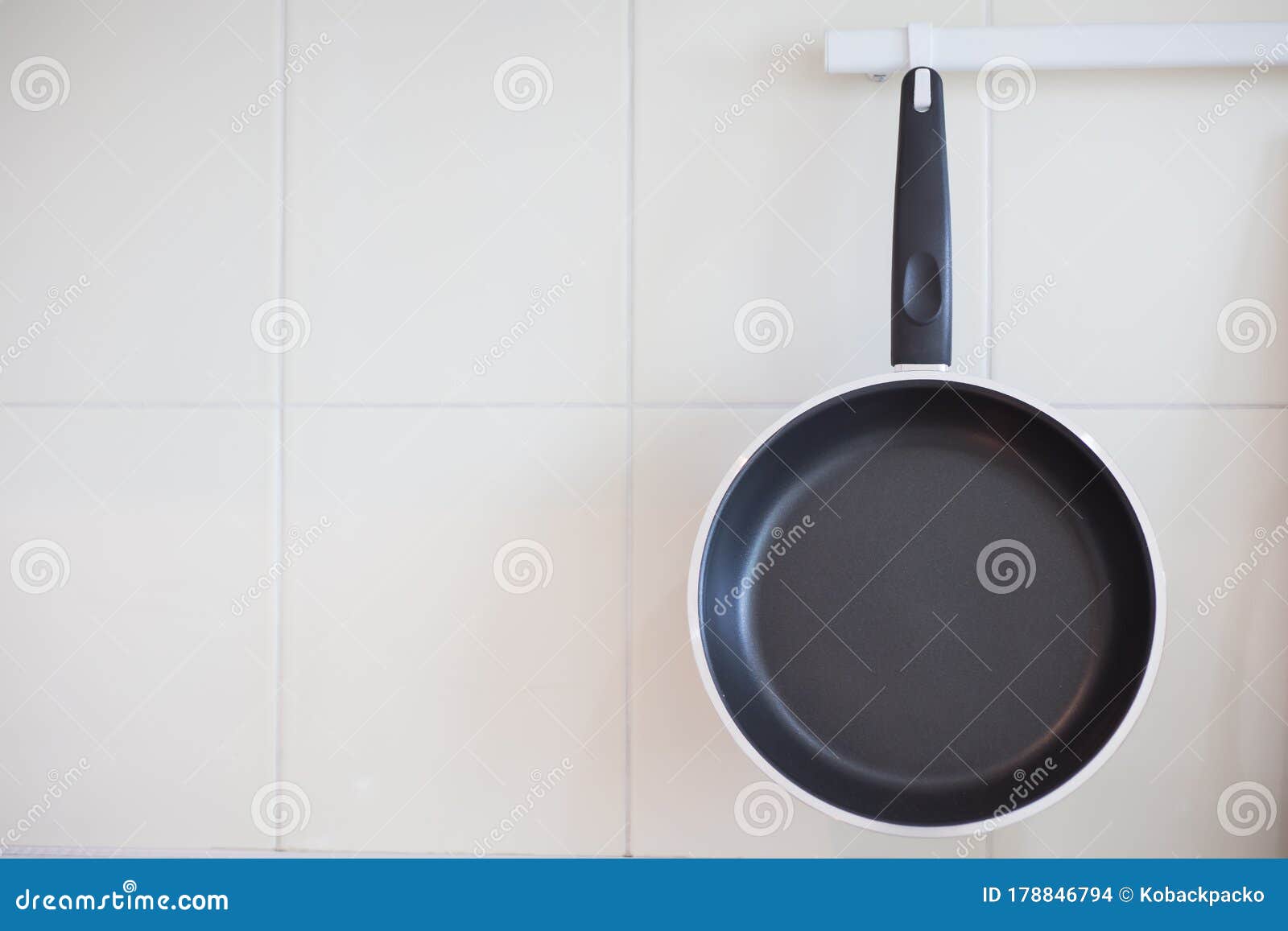 Close Up Empty Frying Pan Hanging on the Kitchen Wall Stock Photo ...