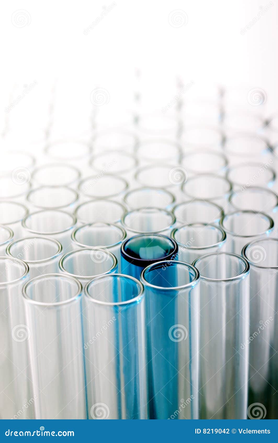 Close-up of Empty Glass Test Tubes, One with a Blu Stock Photo - Image ...