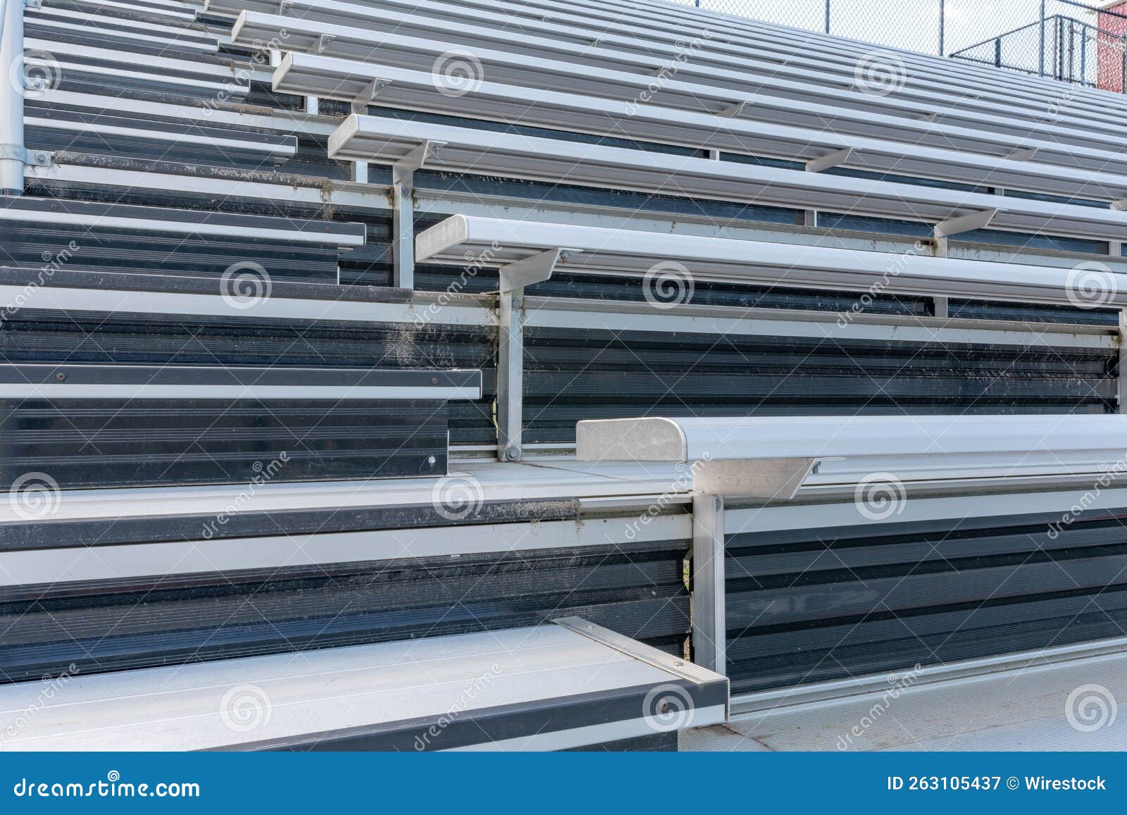 Close-Up of Empty Metal Stadium Bleacher Seats Along Aisle with Steps ...