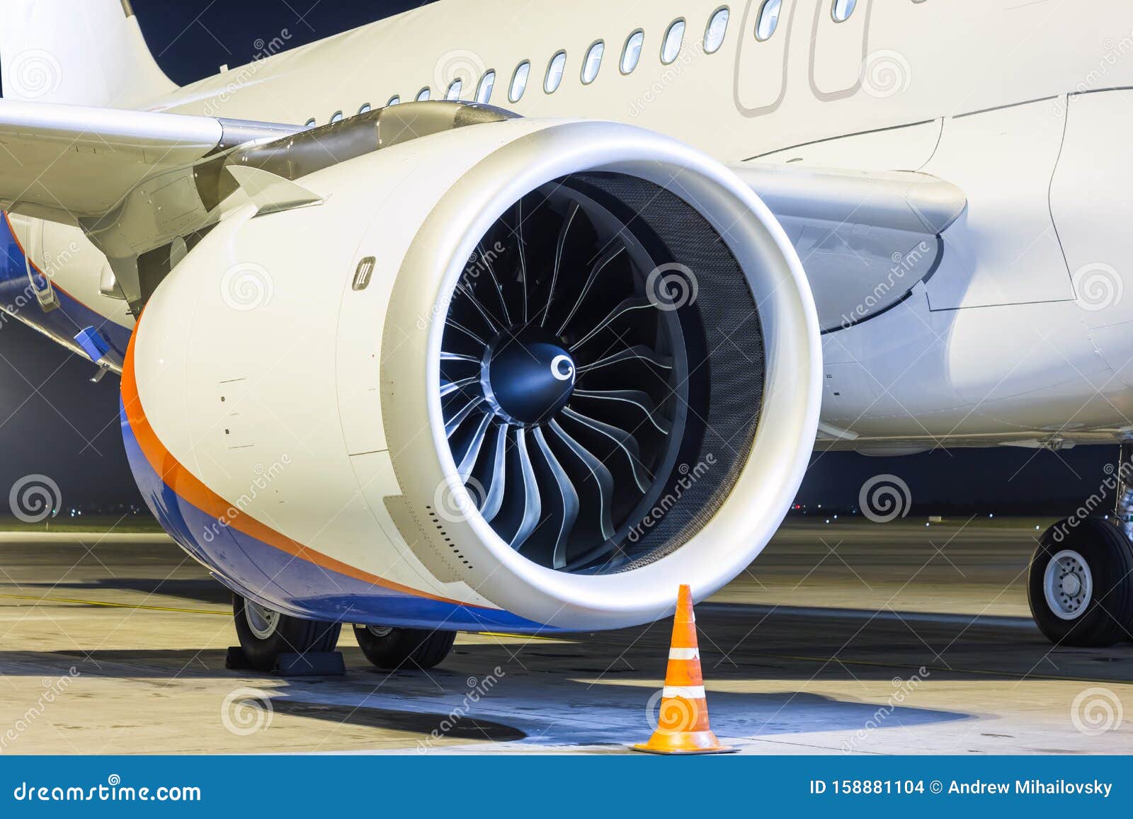 Close-up Passenger Jet Plane Parked To A Boarding Bridge And Connected ...