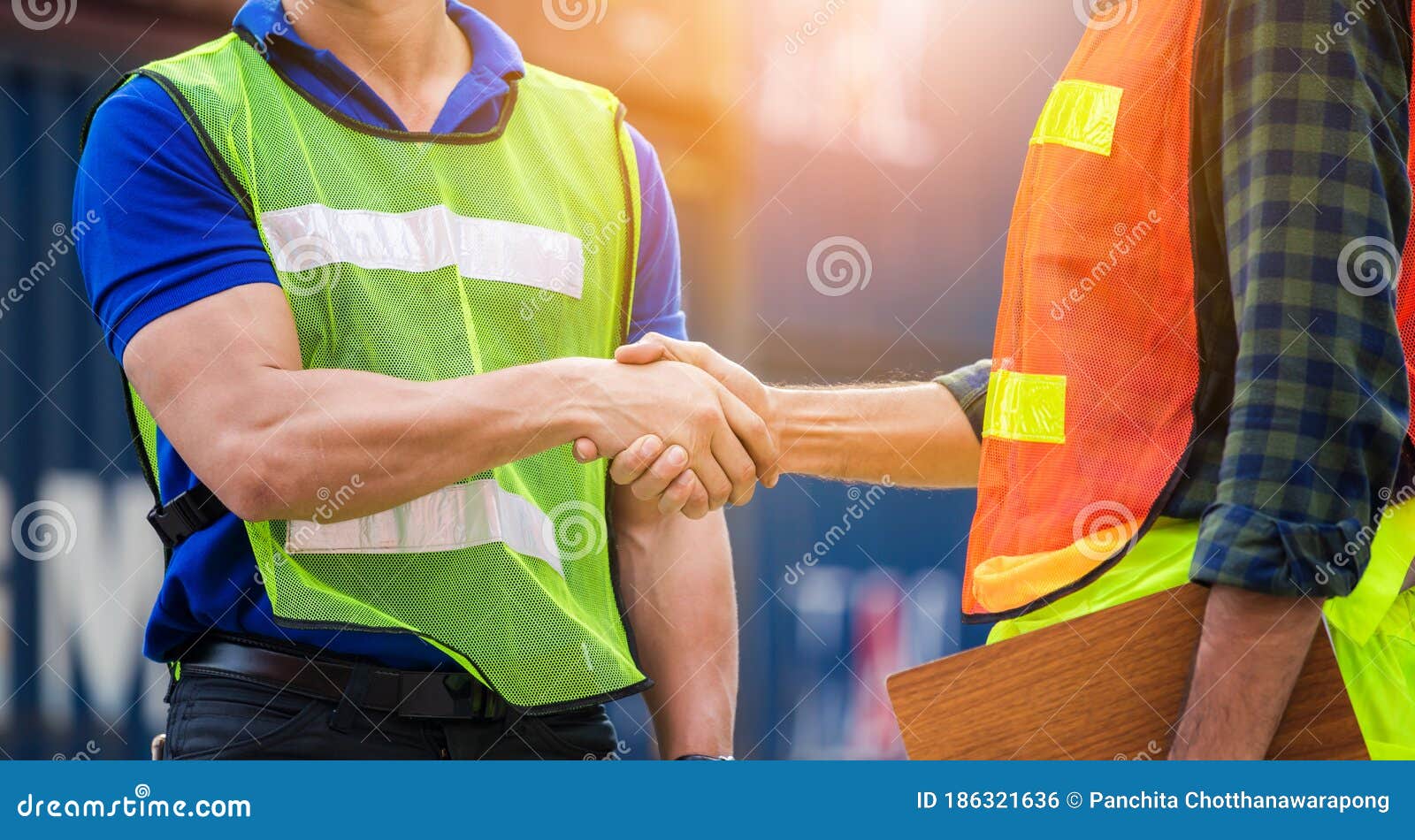 Close Up of Engineer and Foreman Worker Handshake with Blurred ...