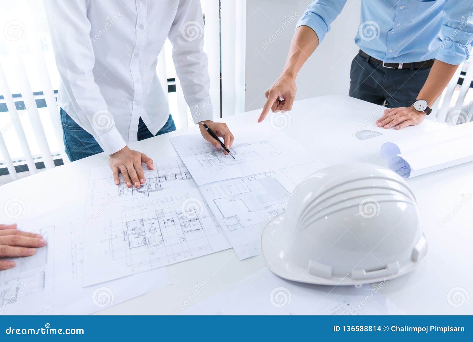 Close Up of Engineer Hands Discussing a Building Construction Project ...