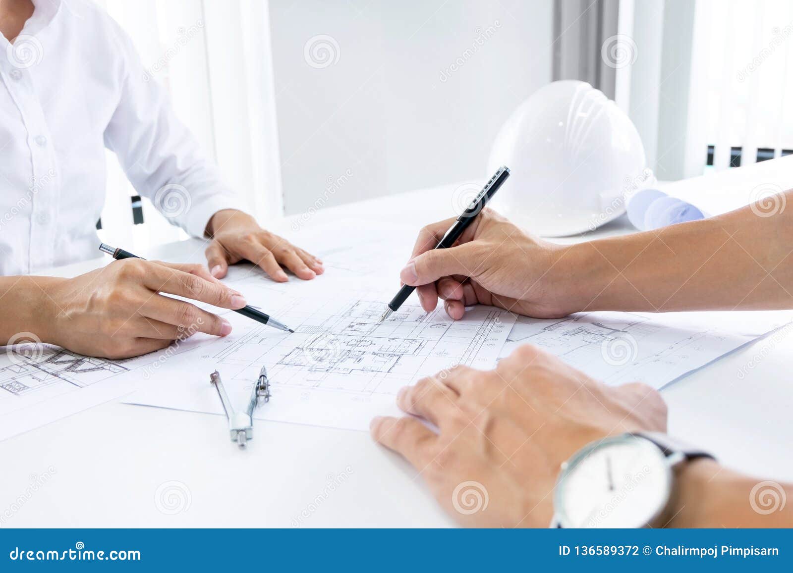 Close Up of Engineer Hands Discussing a Building Construction Project ...