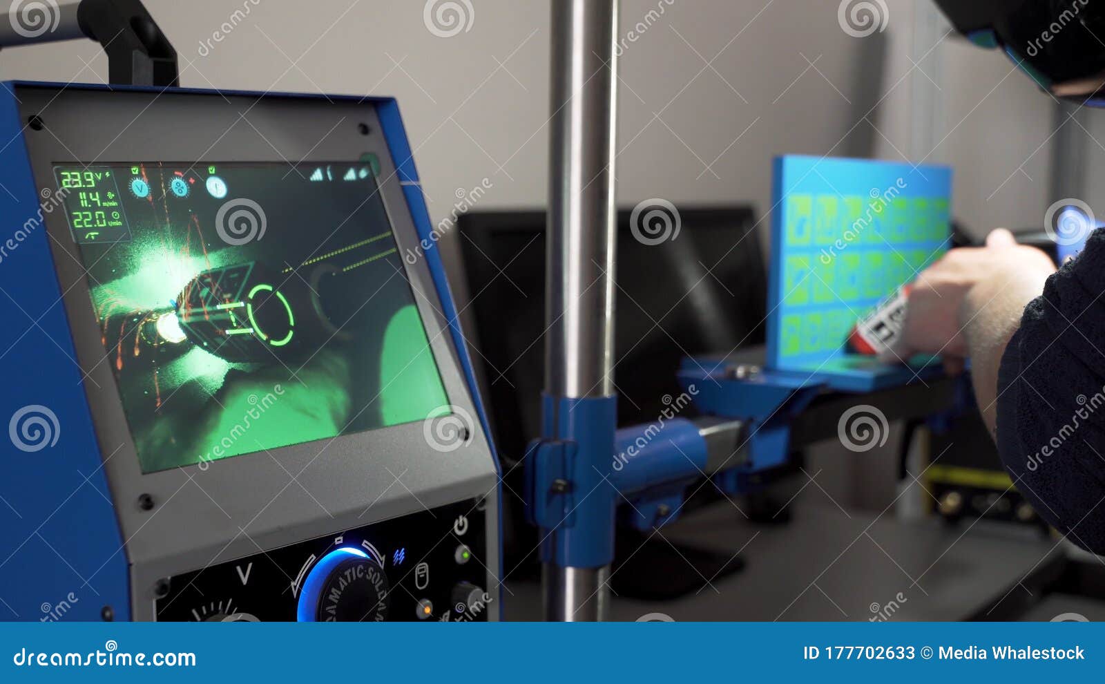 Close Up of an Engineer Using Modern Welding Equipment and a Computer ...