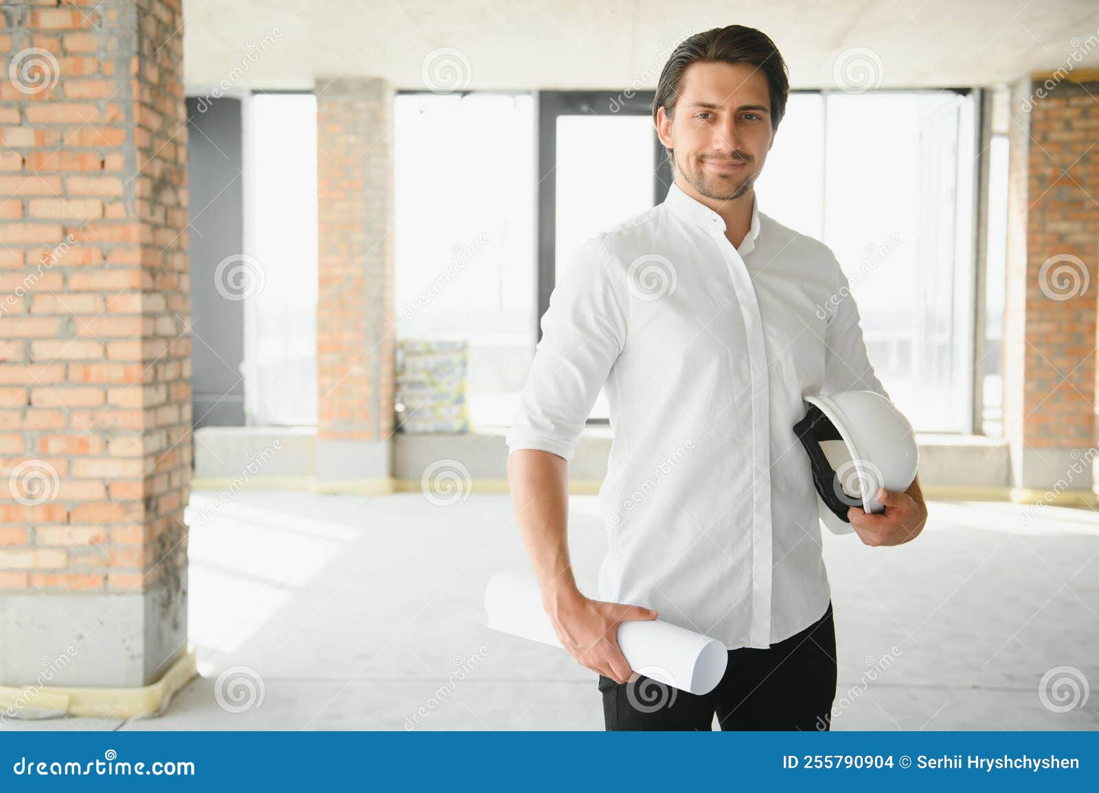 Close Up Engineers Working on a Building Site Holding a Blueprints ...