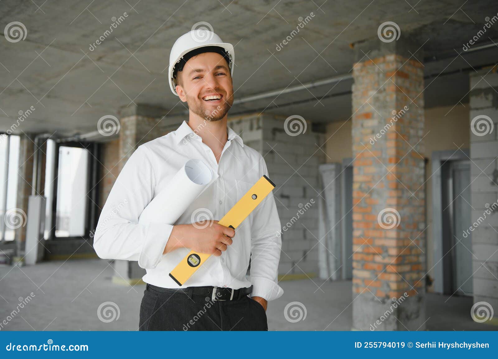 Close Up Engineers Working on a Building Site Holding a Blueprints ...