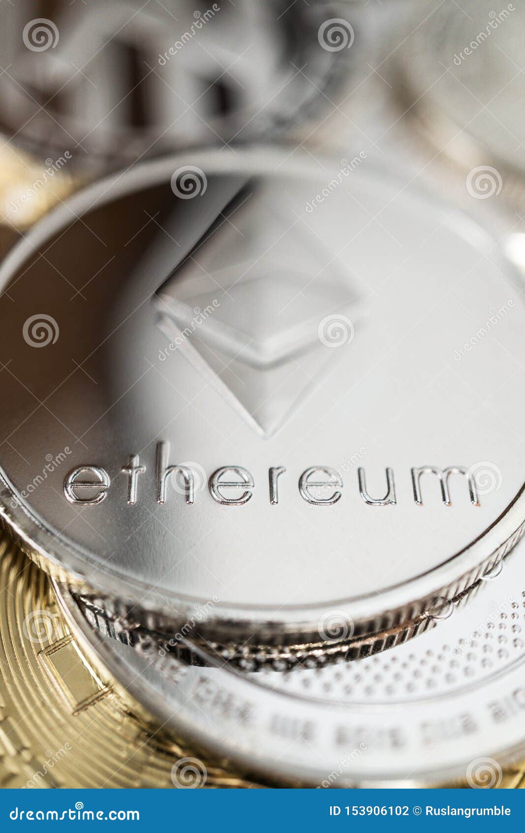 Close-up of Ether Physical Coin on Stack of Many Other Cryptocurrencies ...