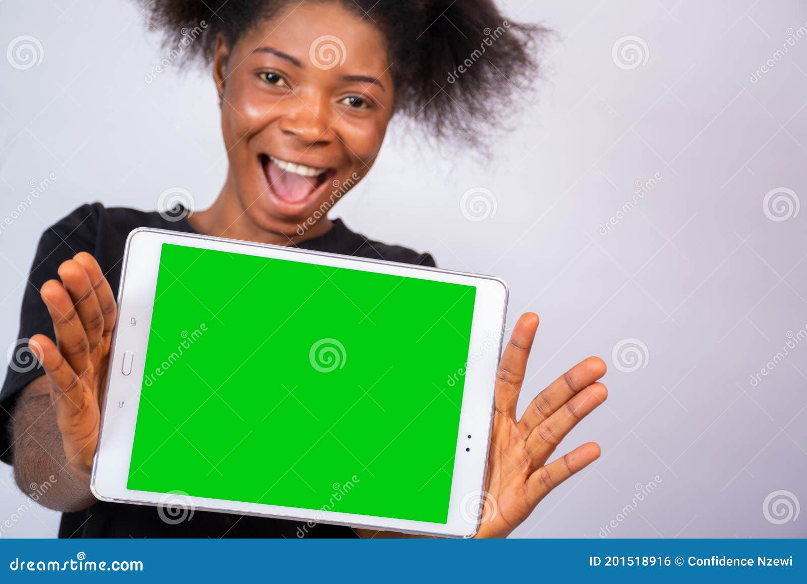 Close Up of an Excited African Lady Holding a Tablet Computer with the ...