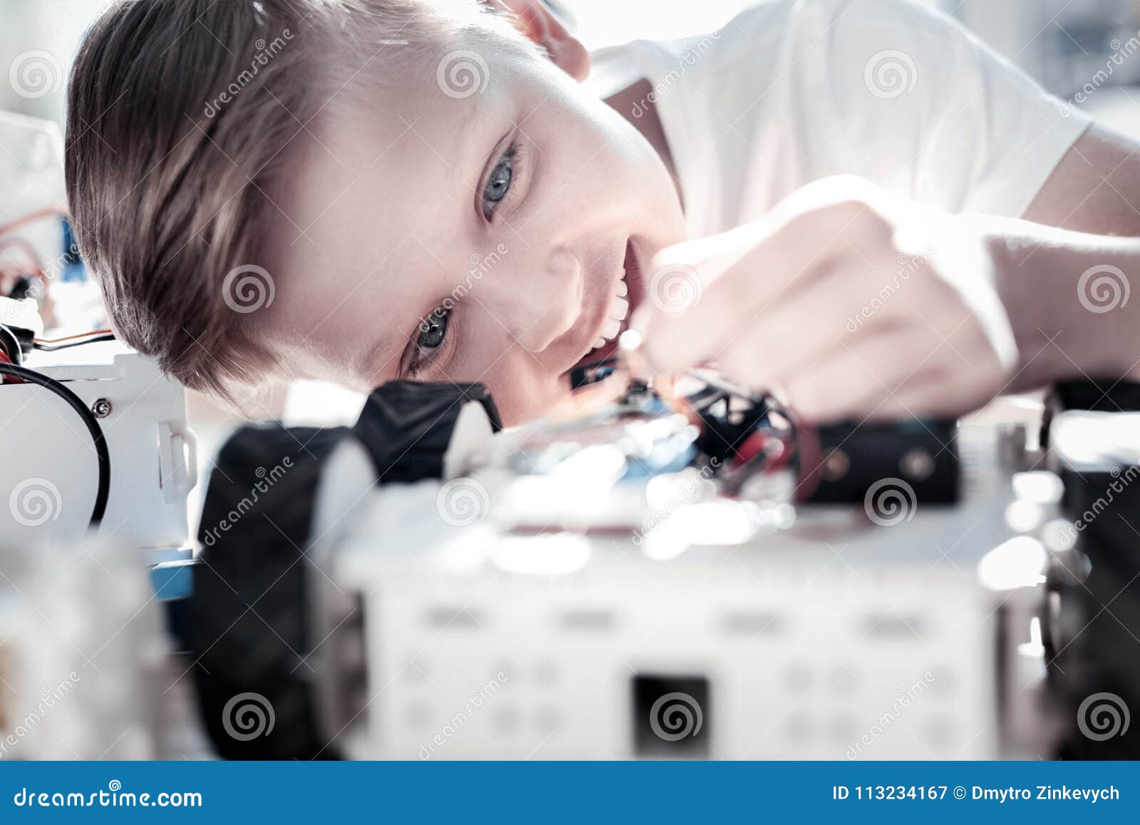Close Up of Excited Boy Constructing Robotic Machine Stock Image ...