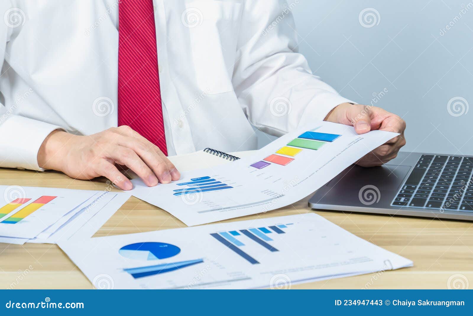 Close Up Executive Work with Graph on Document on Working Desk Stock ...