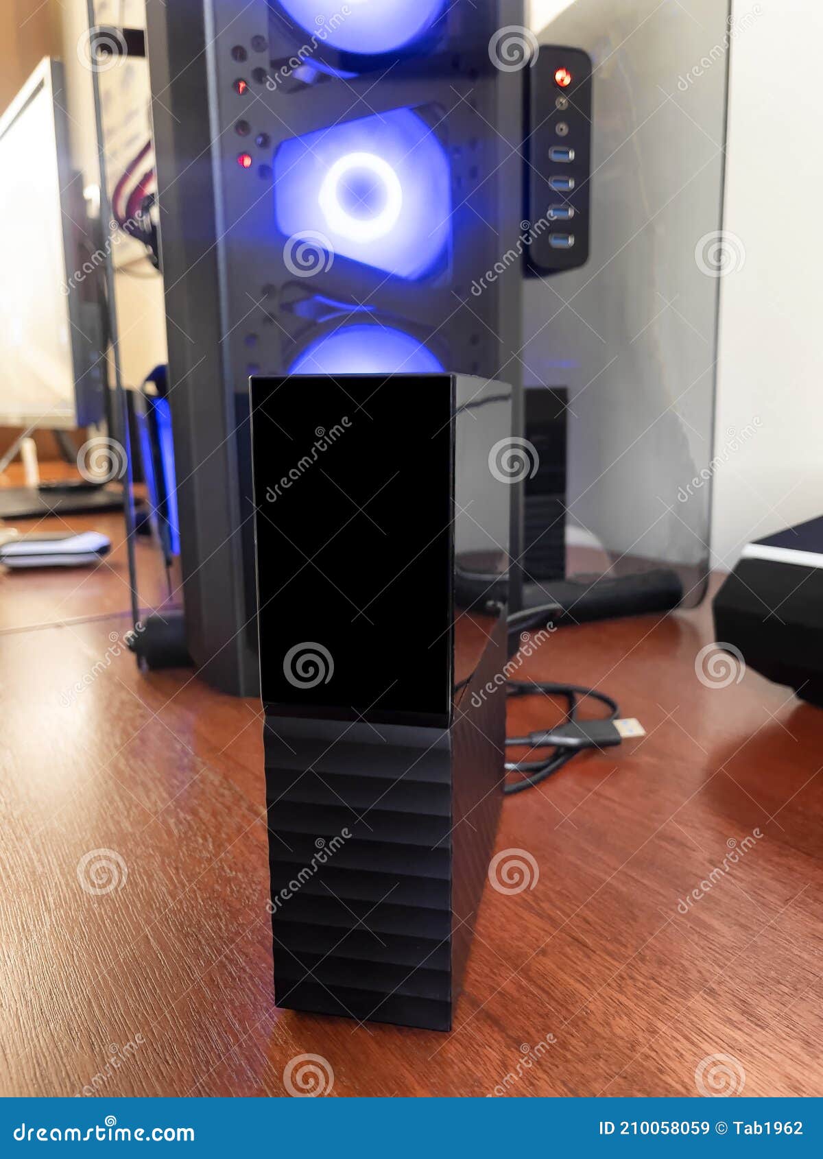 Close Up of an External USB Hard Drive with Computer in Background ...