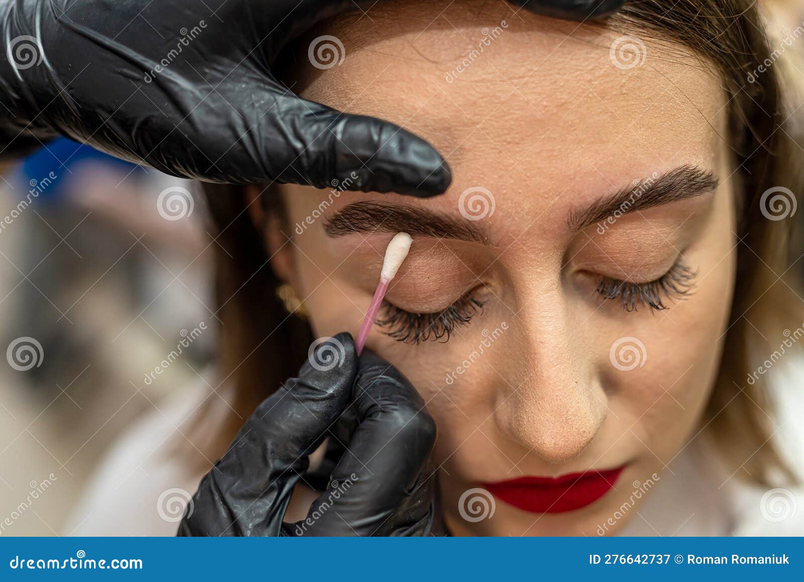 Close-up of an Eyebrow Designer Correcting and Touching Up Eyebrows ...