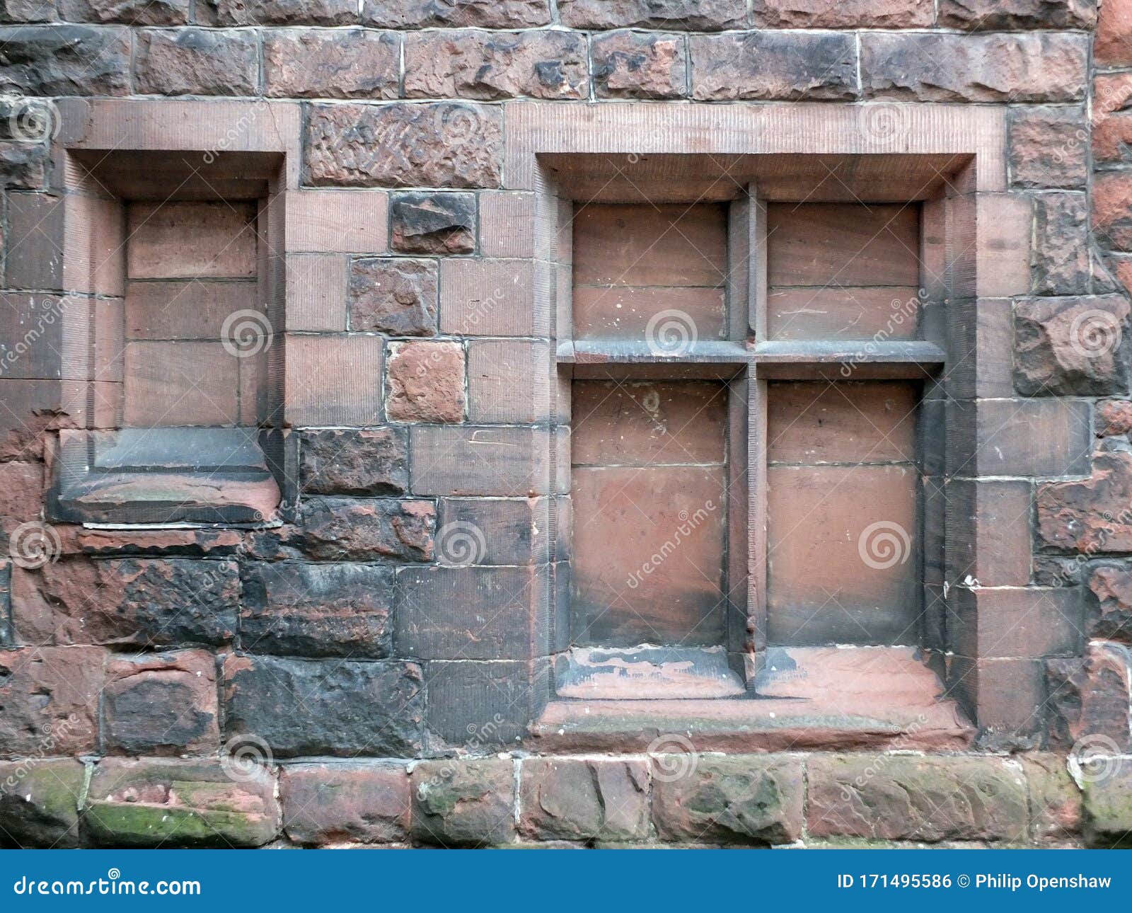 Close Up of the Facade of an Ancient Worn Red Sandstone Building with ...