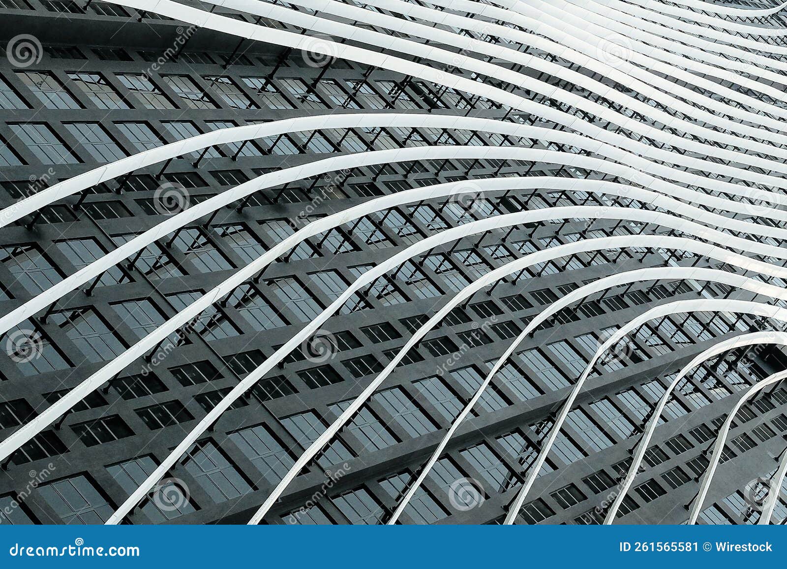 Close-up of a Facade of a Modern Building with Wavy Metallic Lines ...
