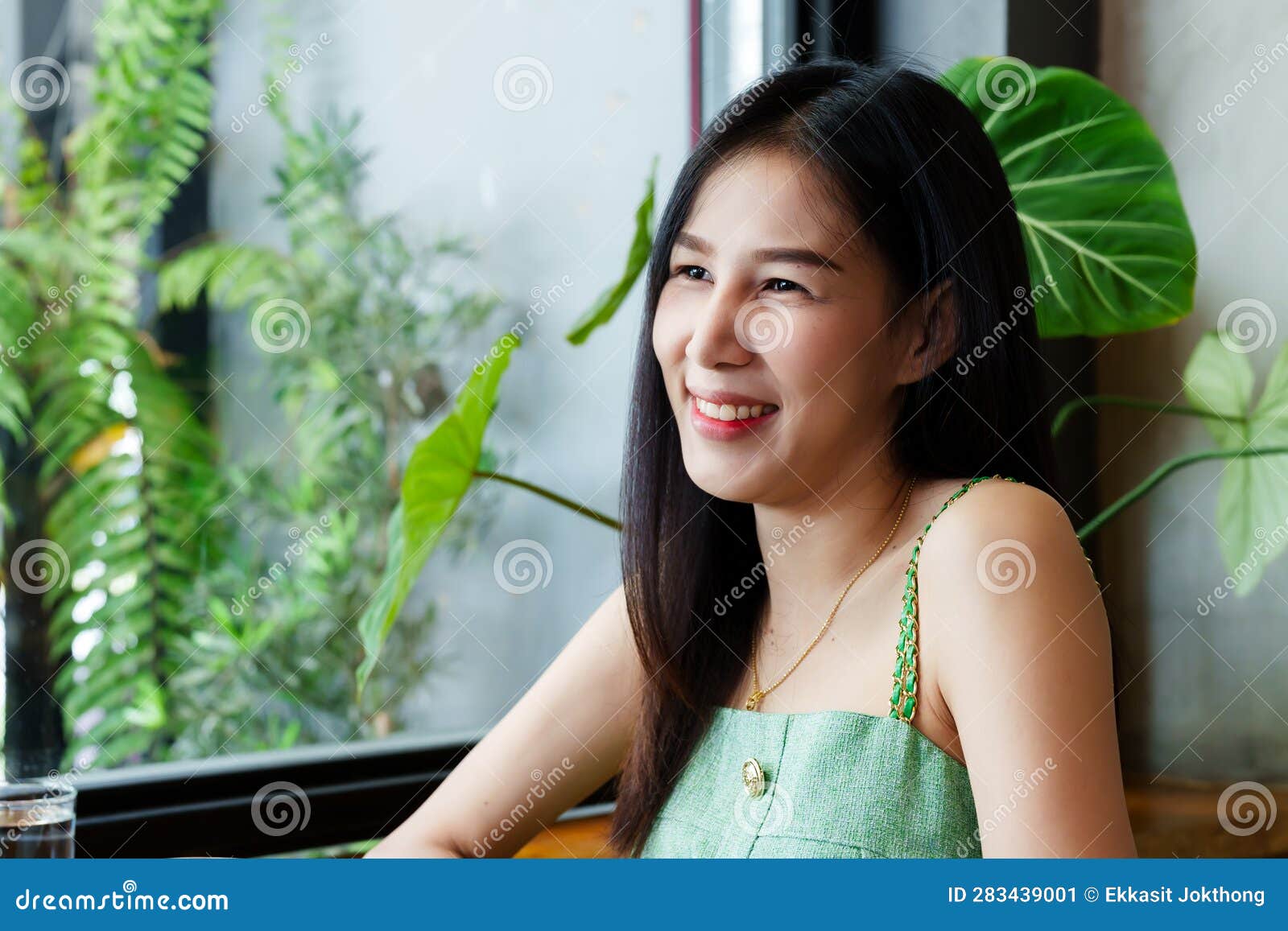 Close Up Of The Face Of A Beautiful Asian Woman With Long Hair Smiling