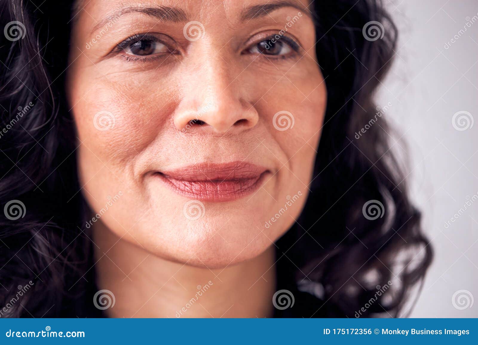 Close Up on Face of Smiling Mature Woman in Studio Stock Photo - Image ...