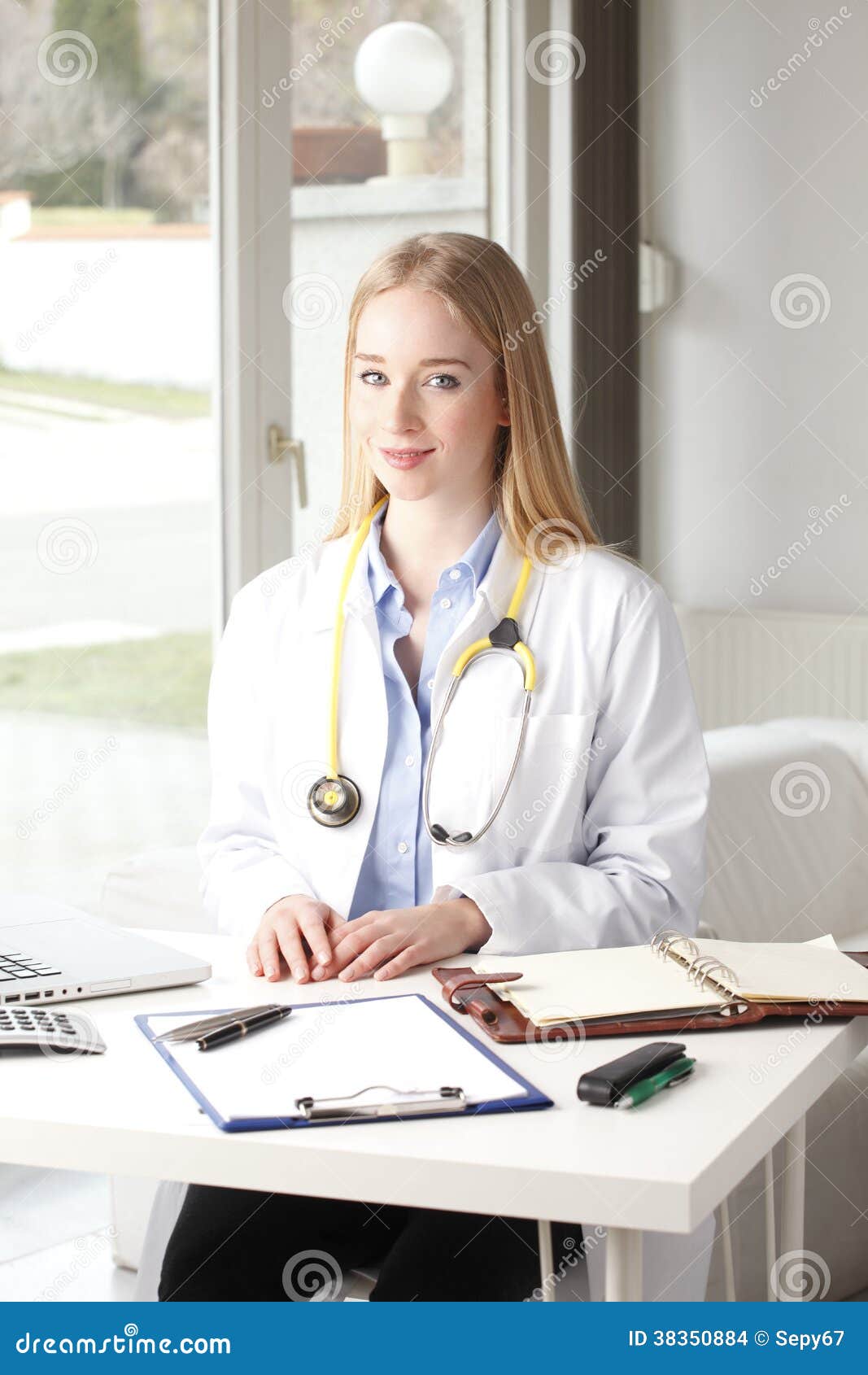 Close-up of a Female Doctor Smiling and Working Stock Photo - Image of ...