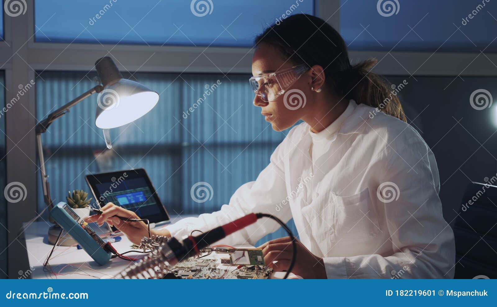 Middle Close Up of Female Engineer of Electronics in White Coat and ...