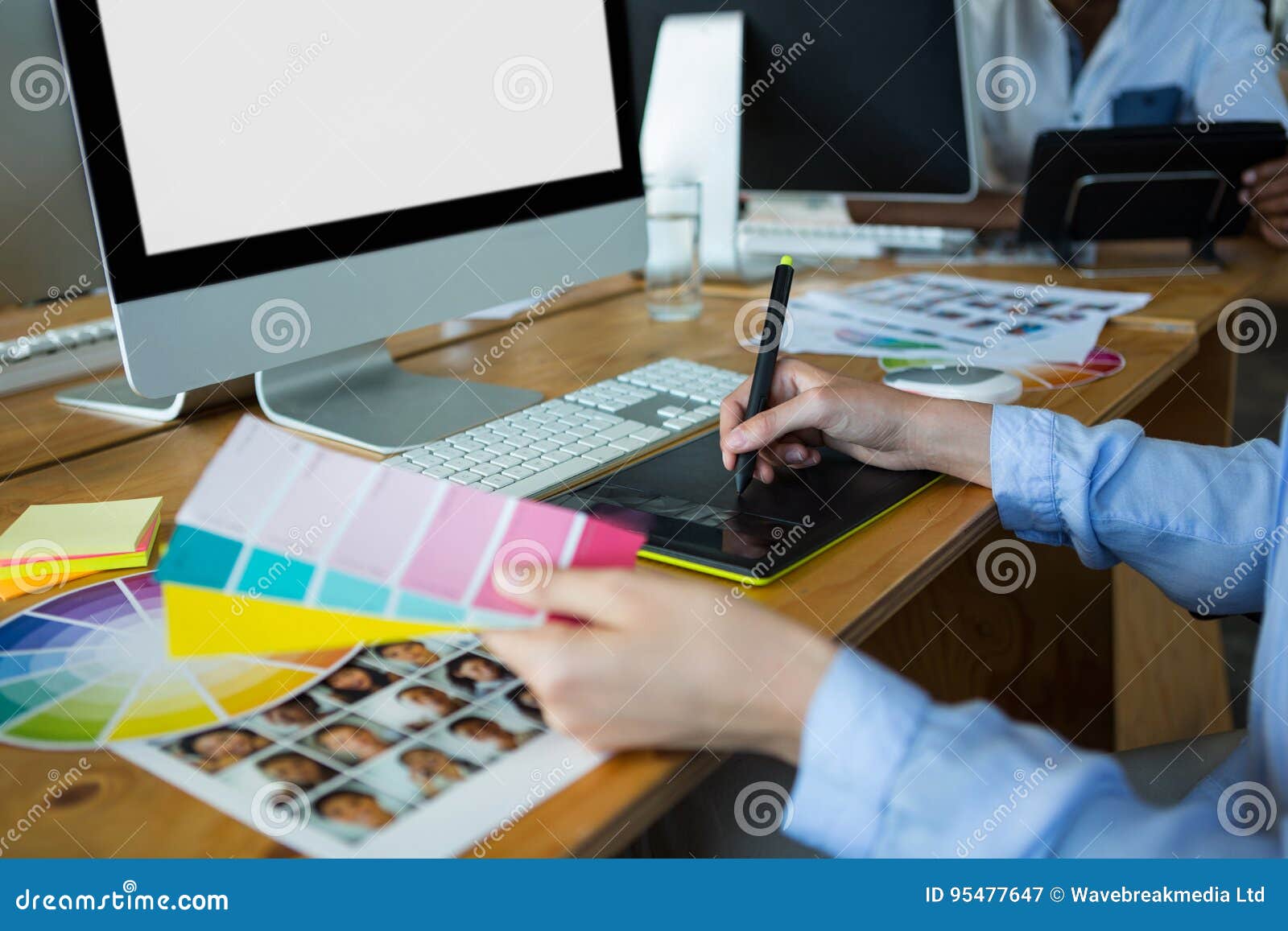 Close-up of Female Graphic Designer Using Graphics Tablet at Desk Stock ...