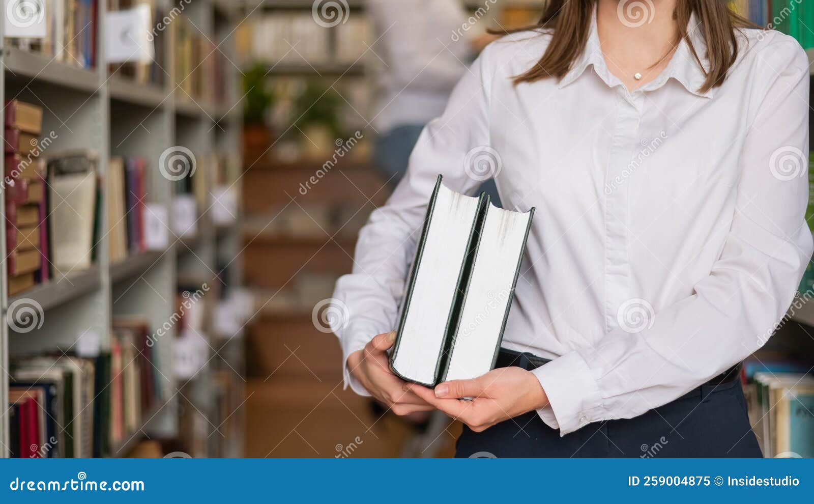 Close-up of Female Hands with Books in Public Library. Stock Image ...