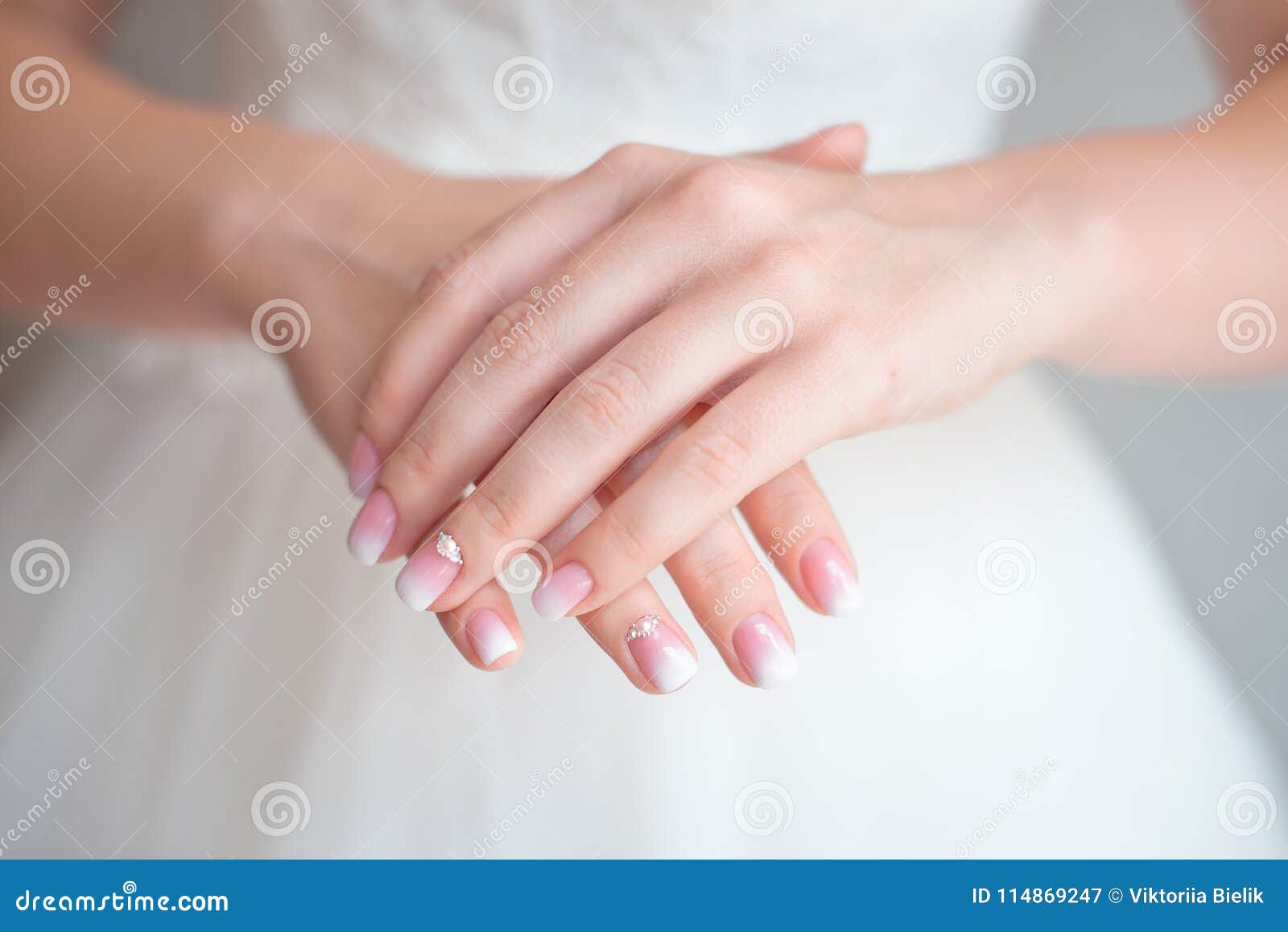 Close-up Female Hands in Focus with Blurred Slim Waist Body on ... Close-up Female Hands in Focus with Blurred Slim Waist Body on ...