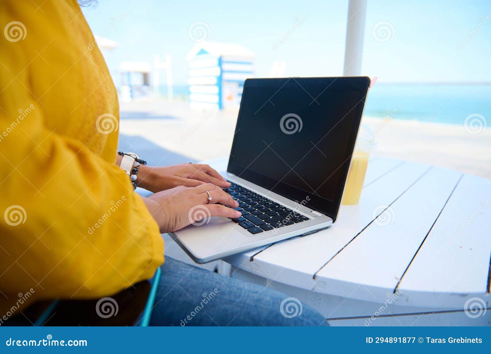 Close-up Female Hands Typing Text on Laptop Keyboard. Back Empty Screen ...