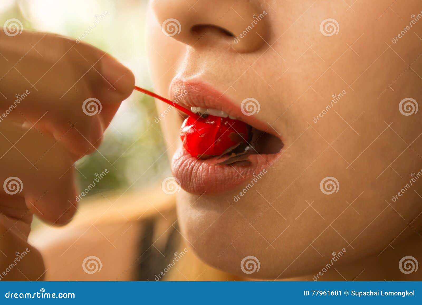 Close Up of Female Mouth with Pink Lips Bite on a Cherry. Stock Image ...