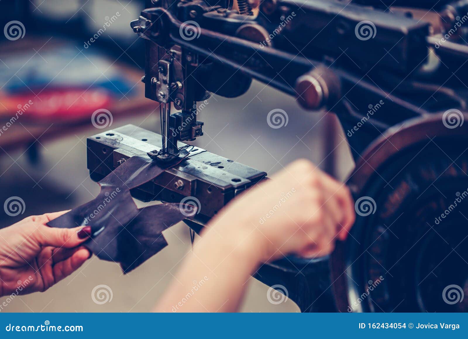 Close Up of a Female Shoemaker Hands Stitching a Part of the Shoe Stock ...