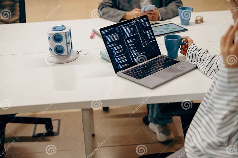Close Up of Female Software Engineer Writing Code on Laptop with ...