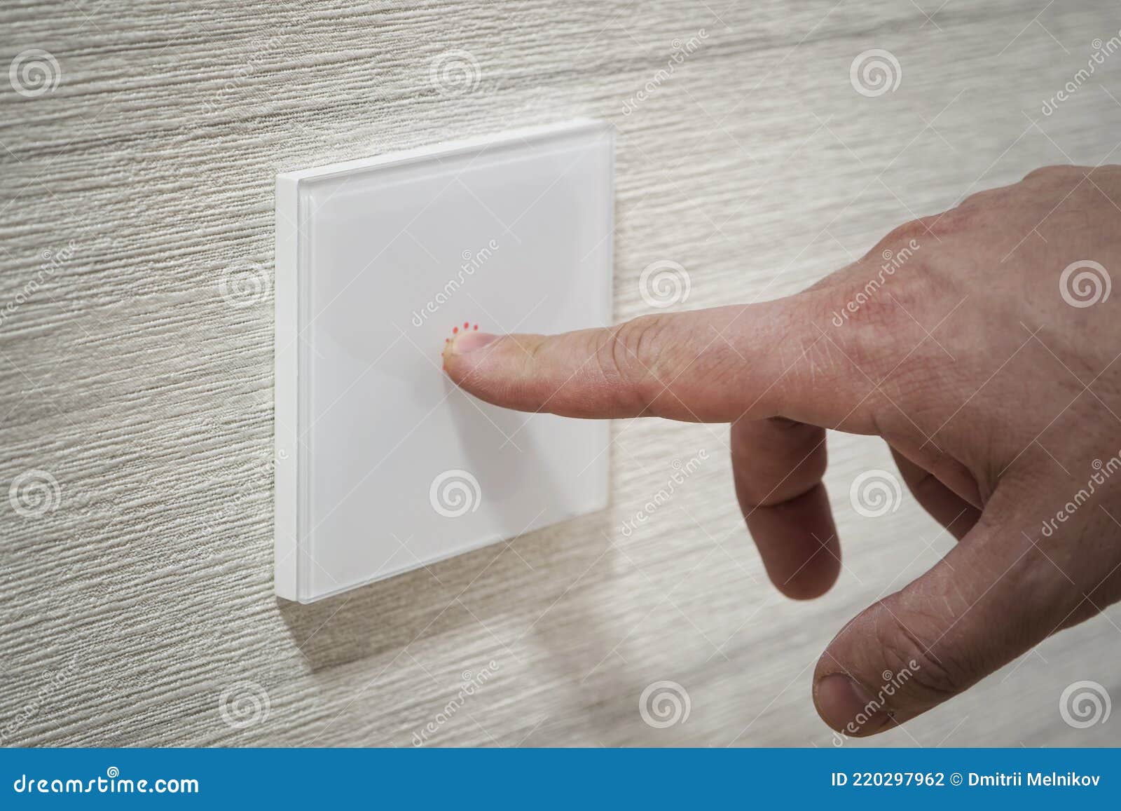 Close-up Finger Turns on the Light on the Touch Switch. a White Modern ...