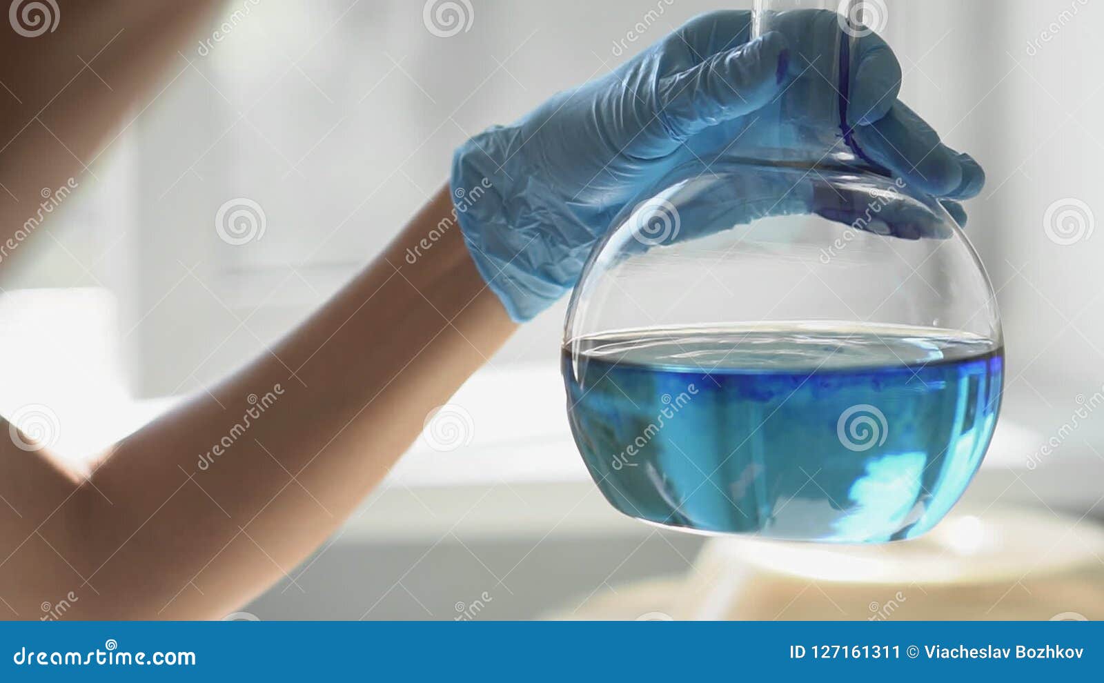 Close-up of a Flask in a Laboratory Experiment, with Blue Liquid ...