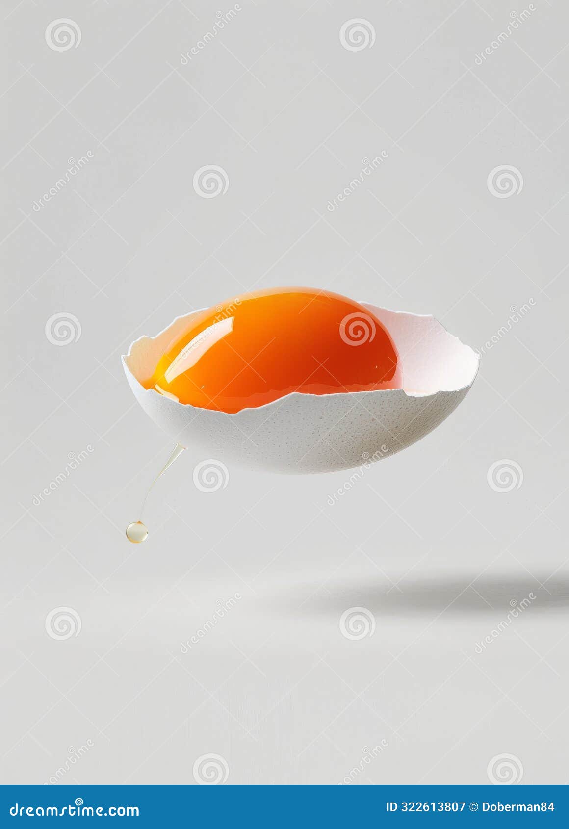 Close-up of a Floating White Eggshell with Vibrant Orange Yolk and ...