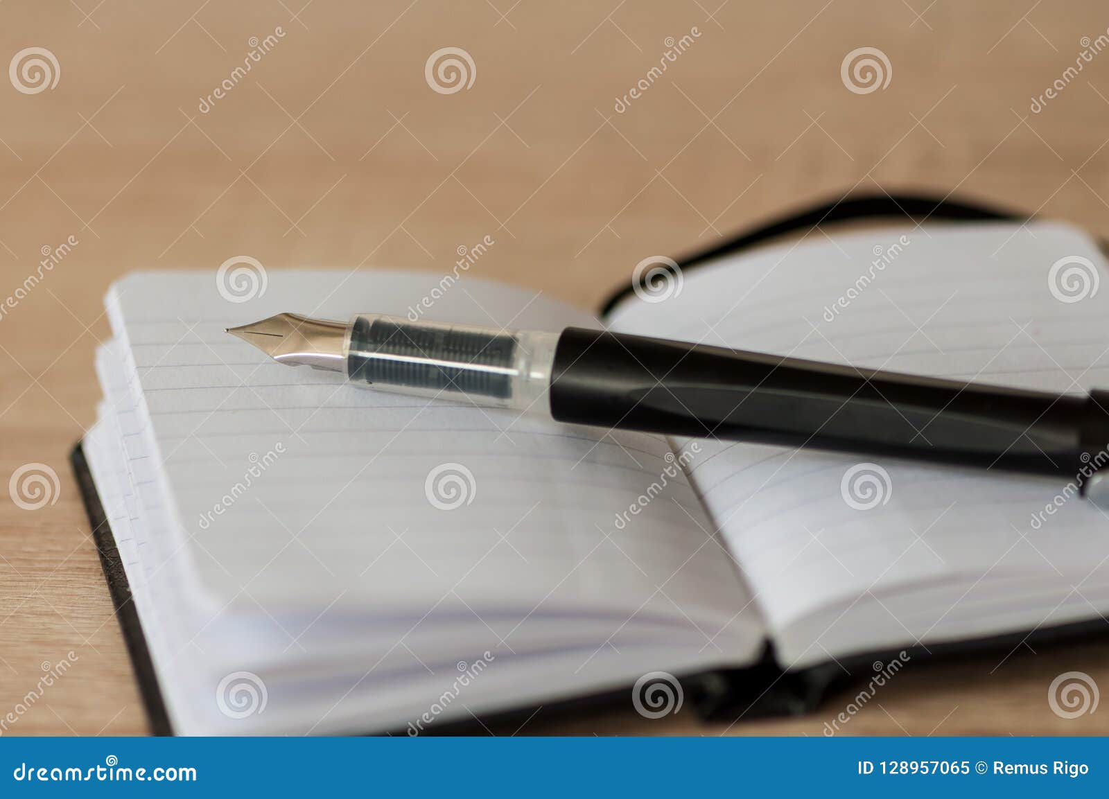Fountain pen on a notebook stock image. Image of note - 128957065