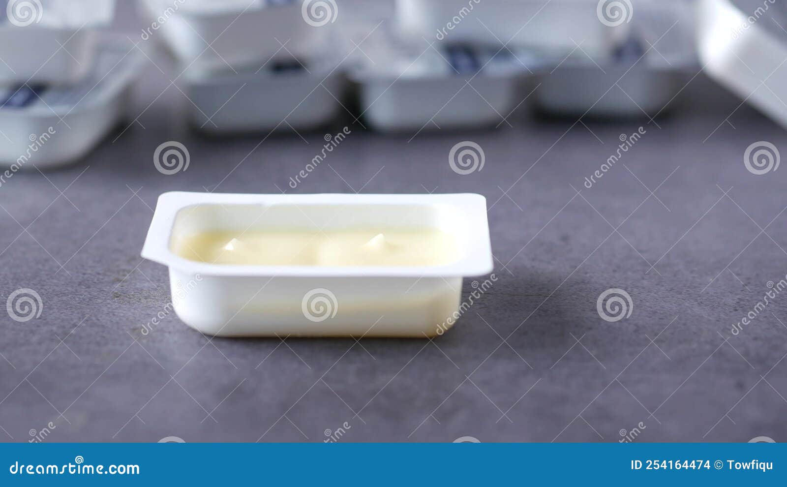 Close Up of Fresh Butter in a Small Plastic Container Stock Footage ...