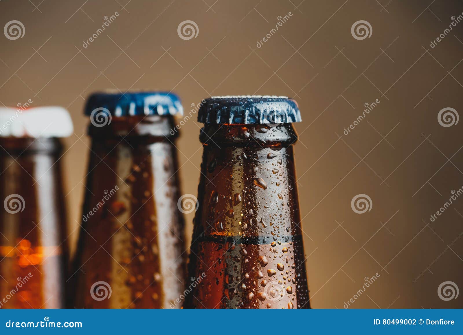 Close-up Of Fresh Cold Beer Ale Bottles With Drops And Focus On Stopper ...