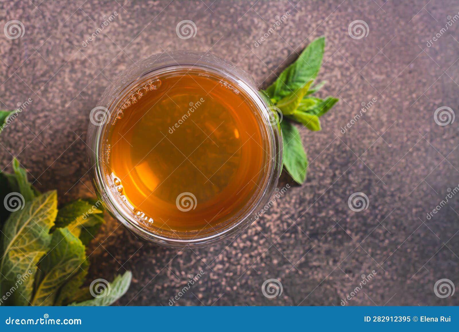 Close Up of Fresh Mint Tea in a Cup and Leaves on the Table Top View ...