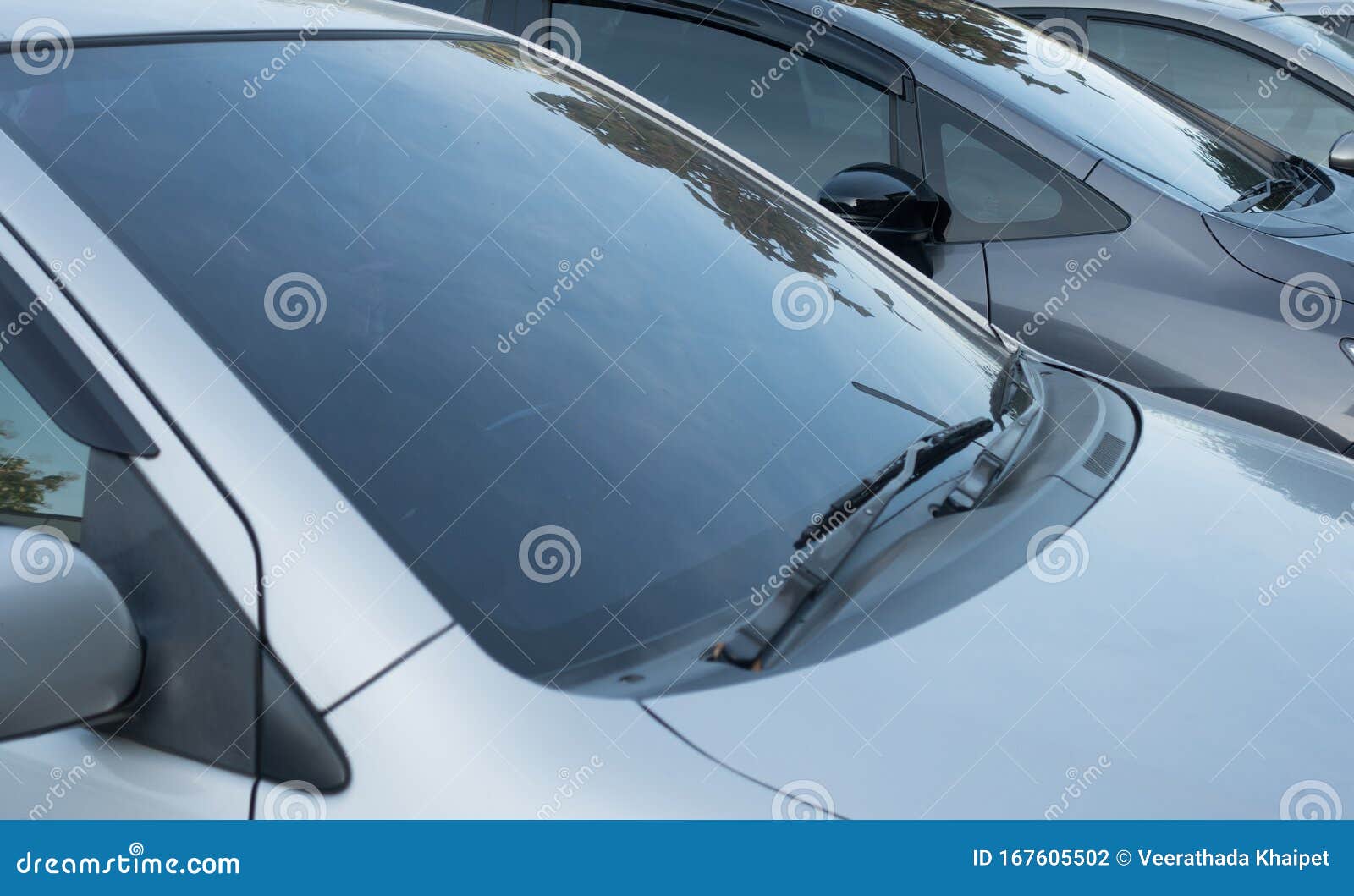 Close-up Front Glass, Window of the Car and the Side Left Mirror on the ...