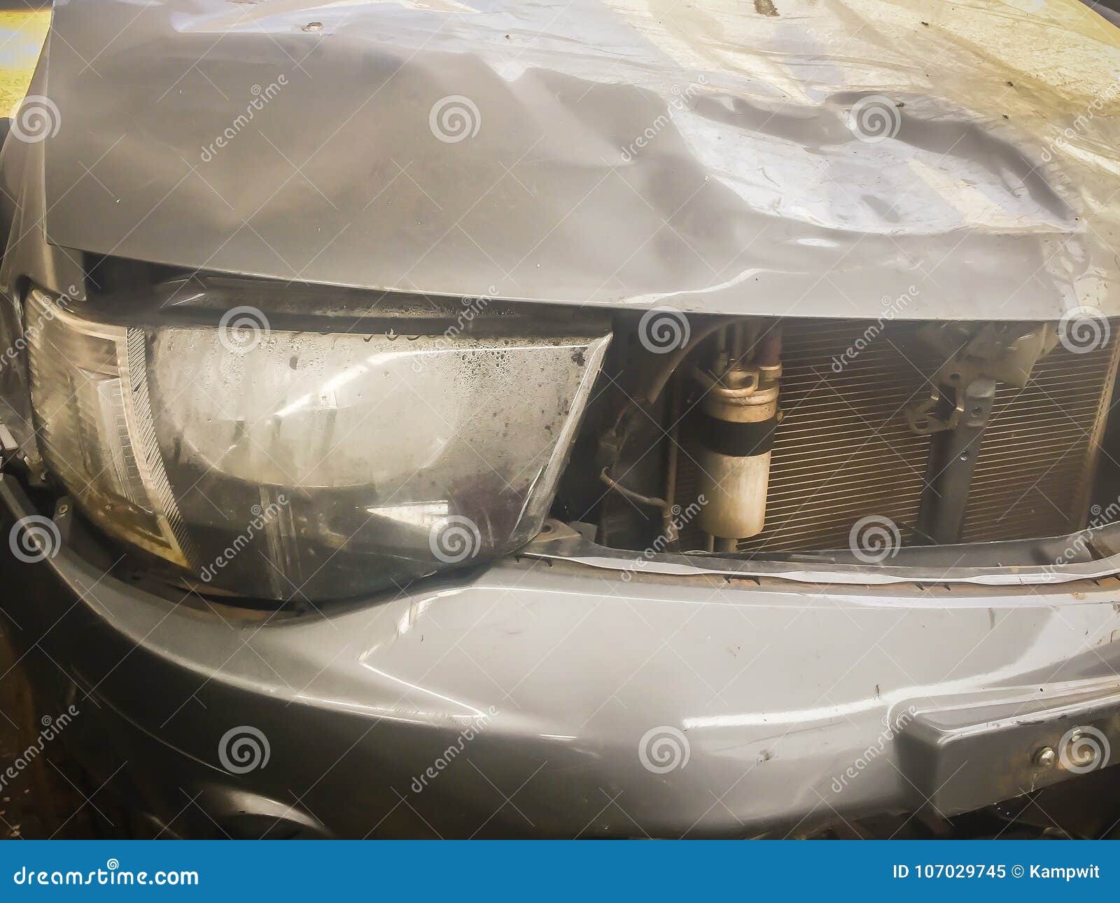 Close-up Front of New Silver Car Distorted by Accident. Crashed Stock ...