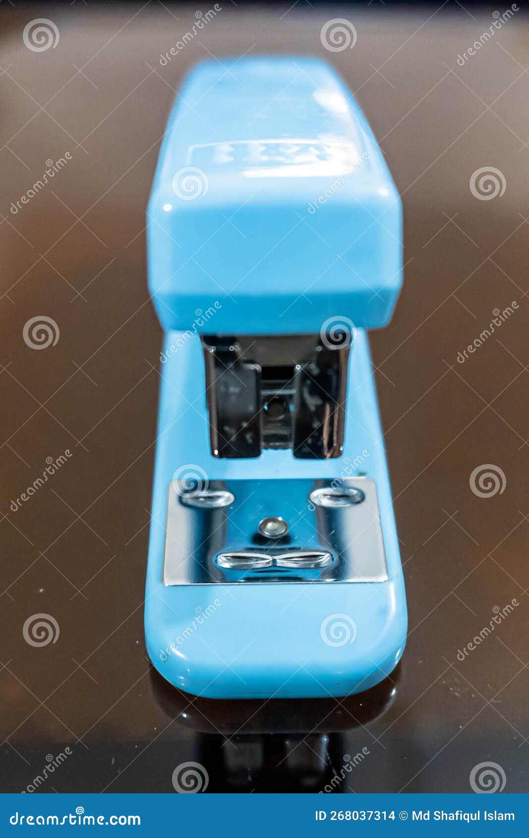 Close Up Front View of Light Blue Stapler Isolated on Glass Background ...