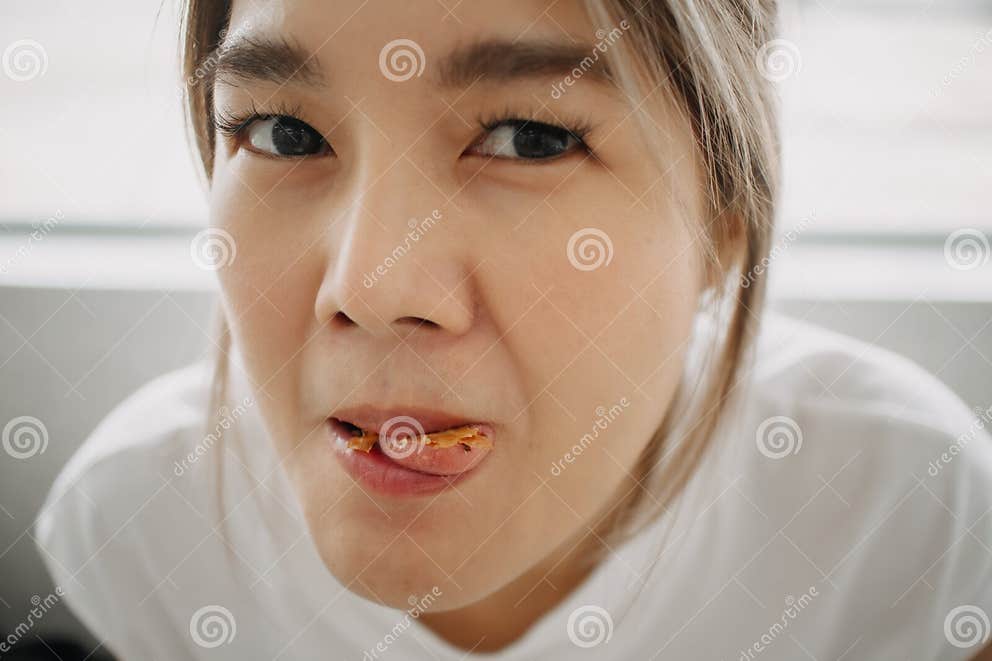 Close Up Funny Face Of Woman Eating Cake In The Cafe Stock Image
