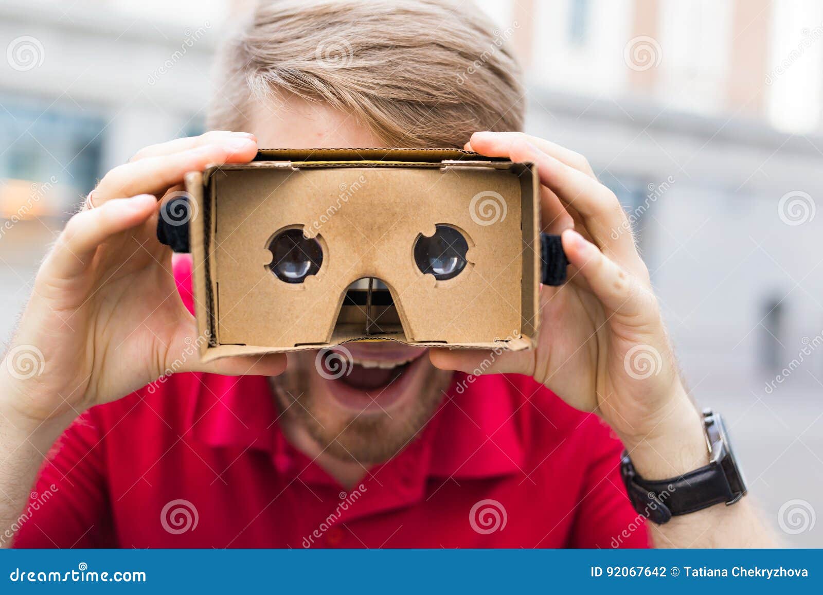 Close-up of Funny Man Using Cardboard Virtual Reality Goggle Outdoors ...