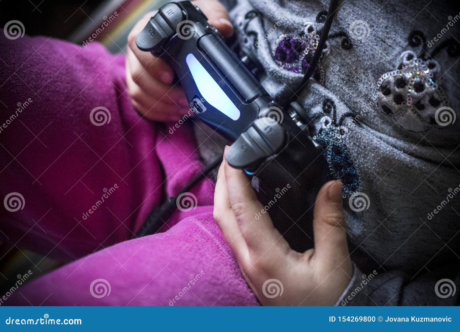 Kid Playing with a Controller Stock Photo - Image of handheld, hands ...