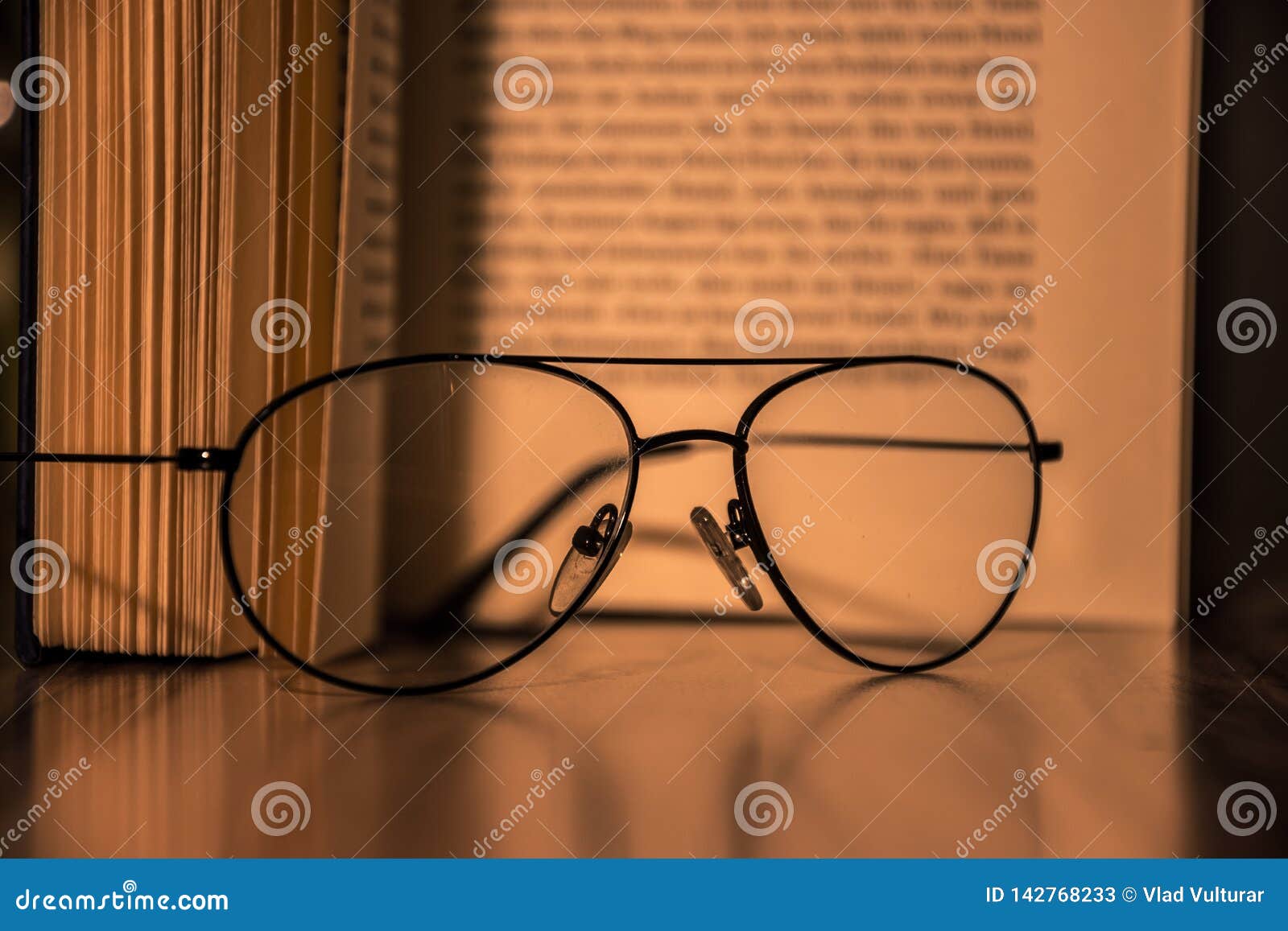 Close Up Of Glasses Laying On A Table In Front Of A Open Book Stock Image Image Of Information